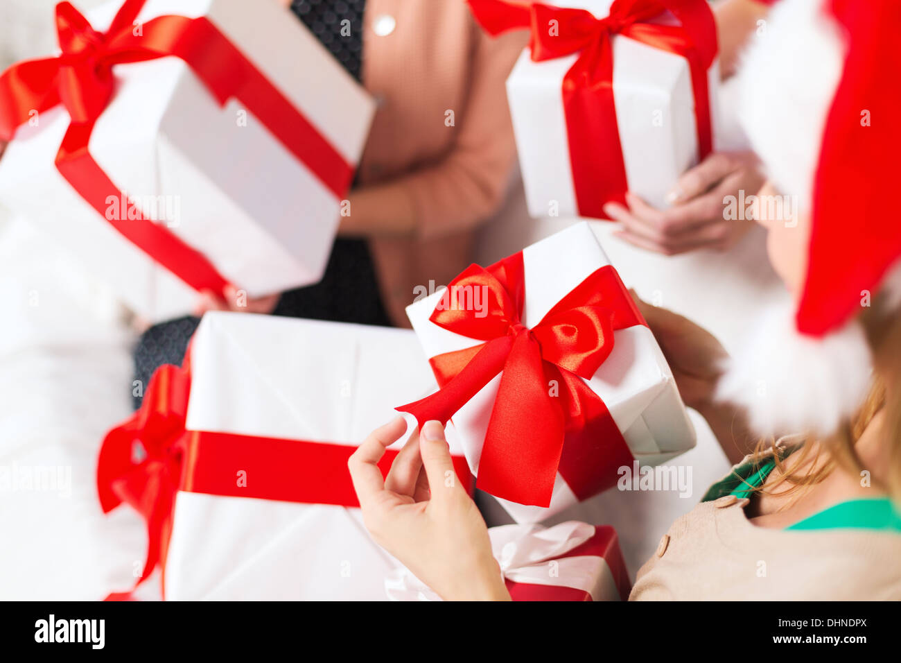 three women holding many gift boxes Stock Photo - Alamy