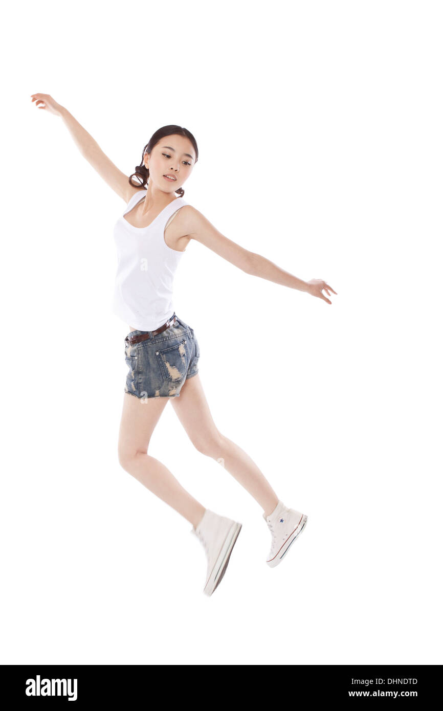 Young woman posing,jumping Stock Photo - Alamy