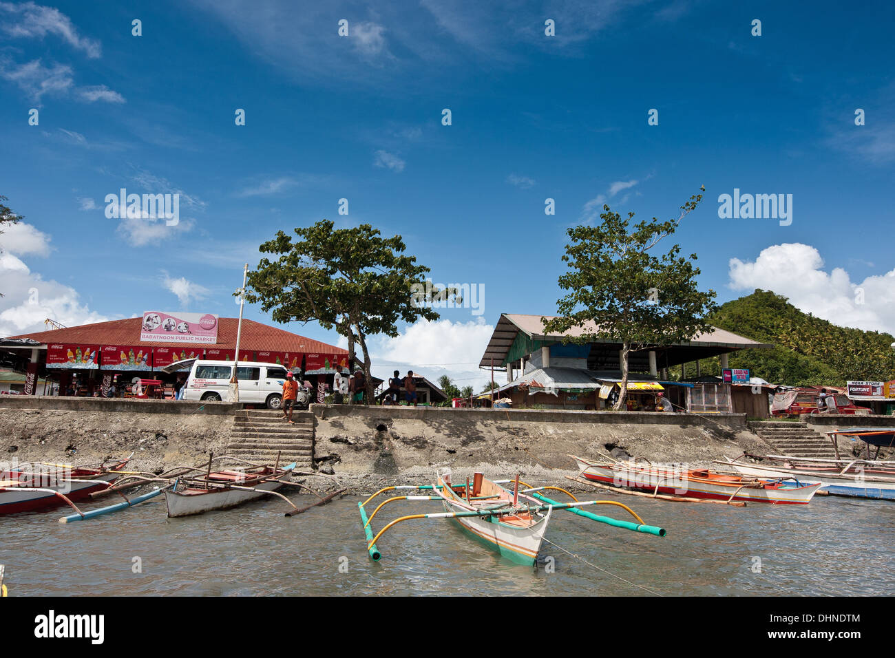 A Filipino port where locals eagerly await customers for the fish and ...