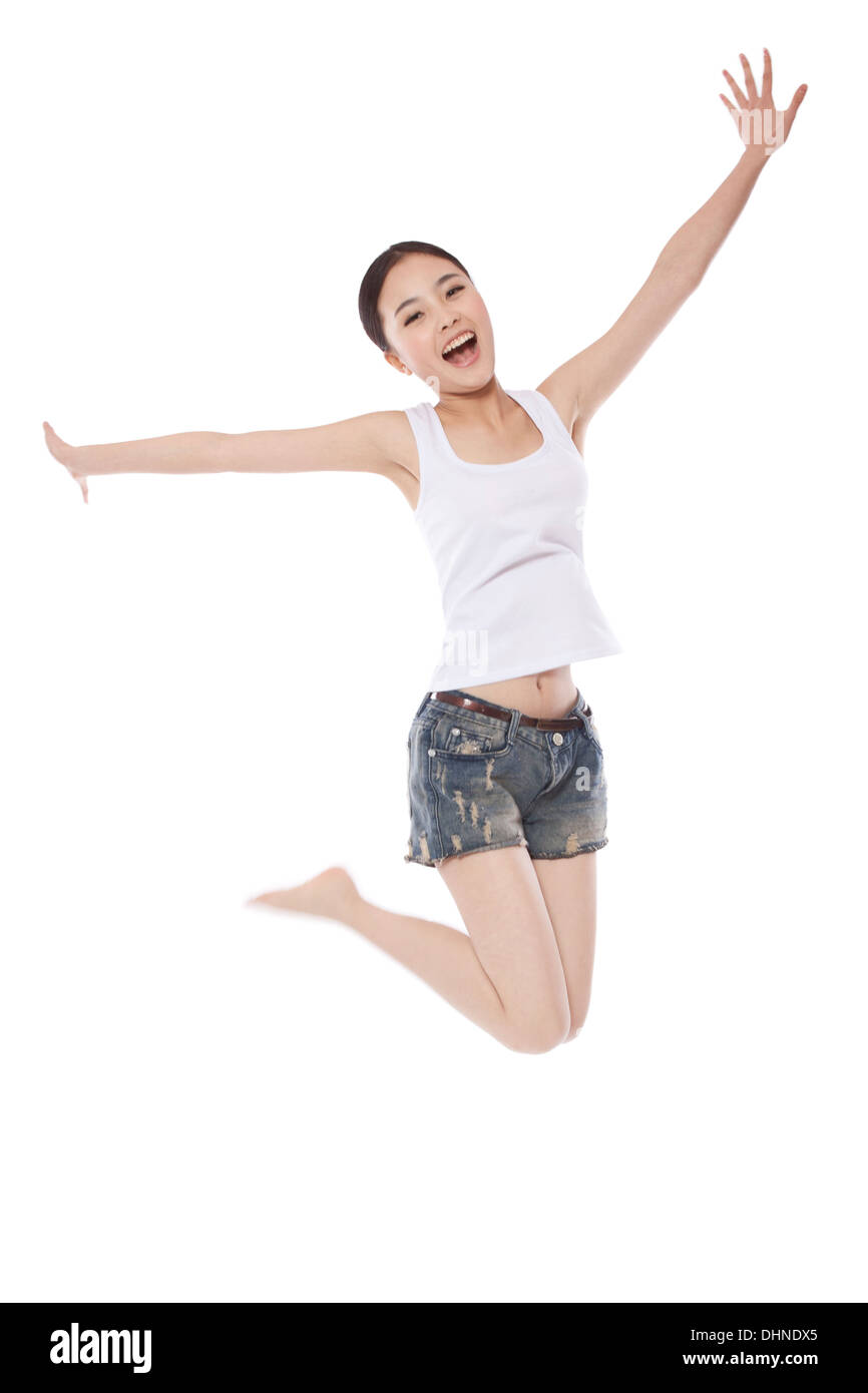 Young woman posing,jumping Stock Photo - Alamy
