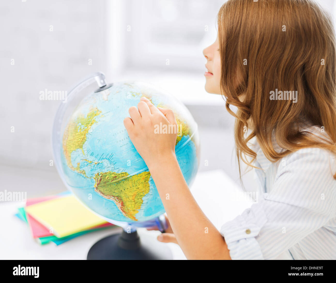 curious student girl with globe at school Stock Photo - Alamy