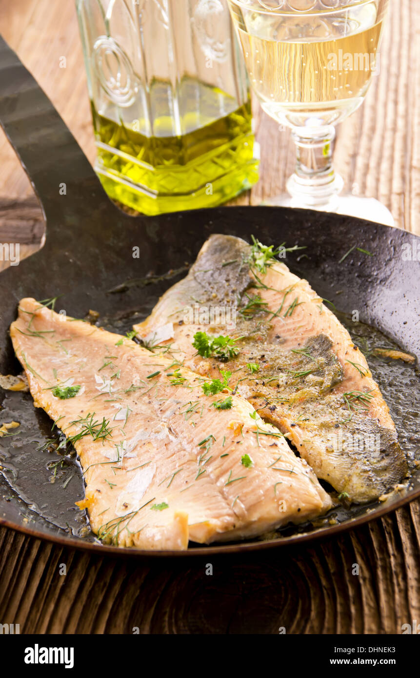 charr fillet fried with fresh herbs Stock Photo - Alamy