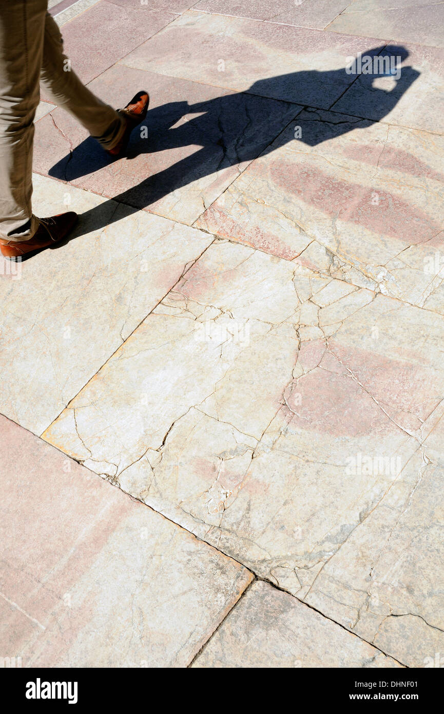 Man walking on paving hi-res stock photography and images - Alamy