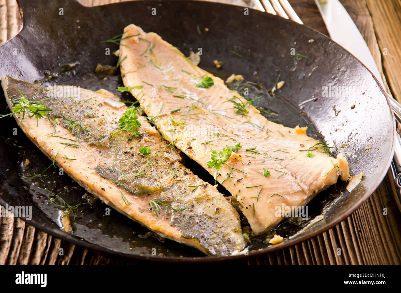 fish fillet fried in the pan Stock Photo - Alamy