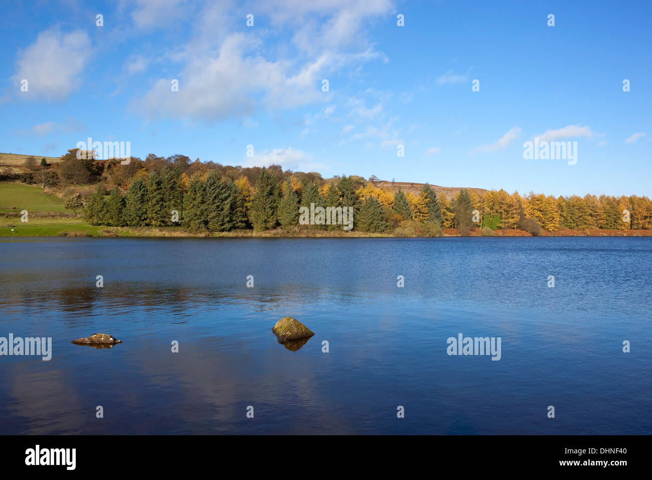 English autumn landscape with blue skies reflected in the water of cod ...