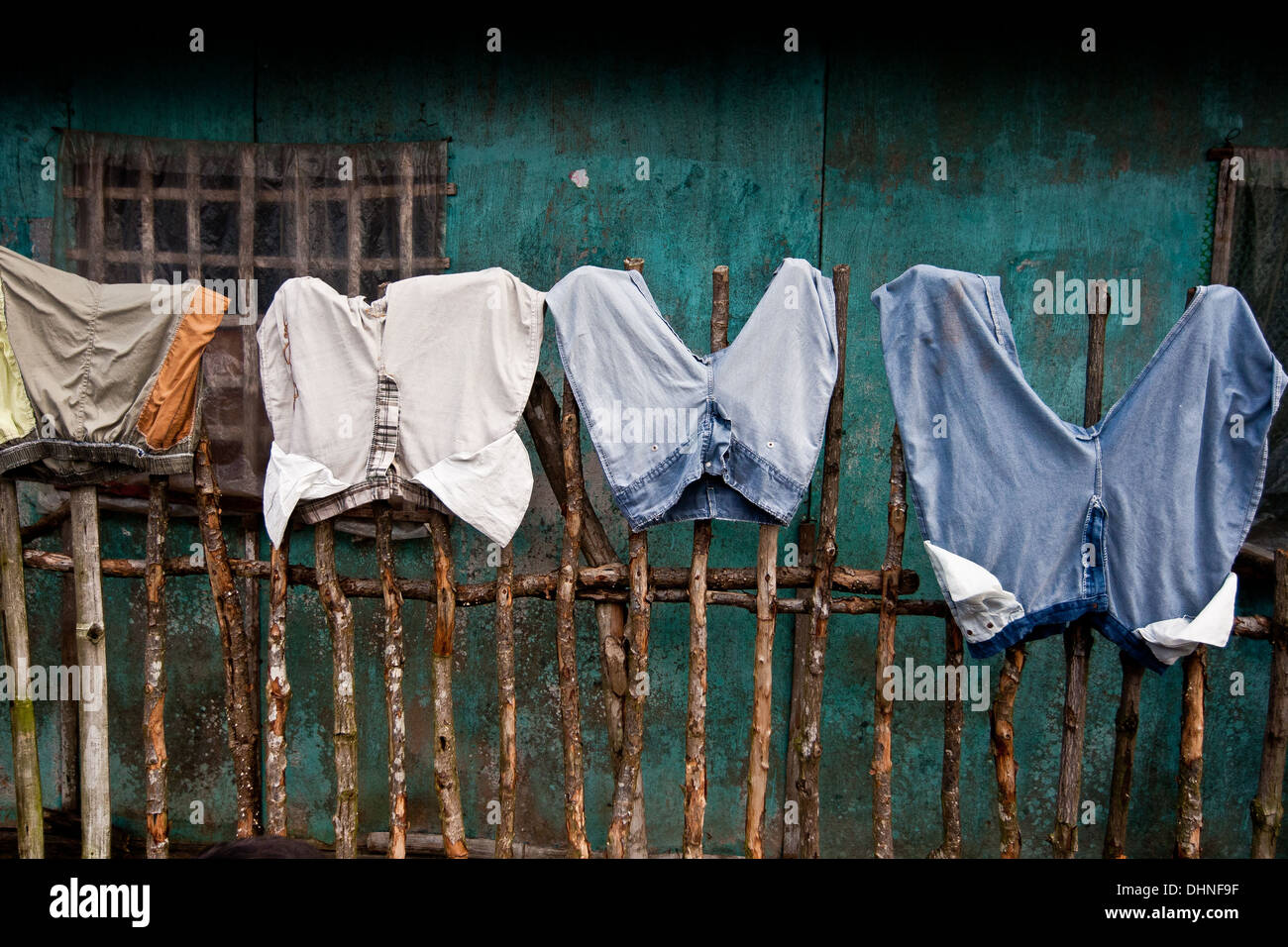 Clothes hang out to dry along a fence in a village on Samar Stock Photo ...