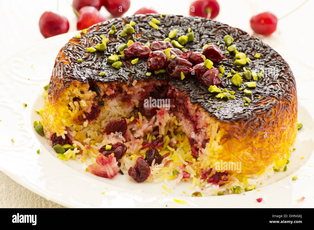 persian rice tah-dig with cherries Stock Photo - Alamy