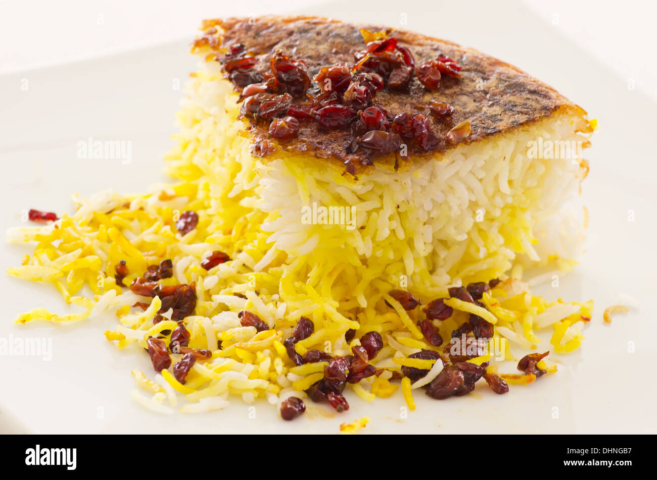 persian saffron rice with berberis Tahchin Stock Photo - Alamy