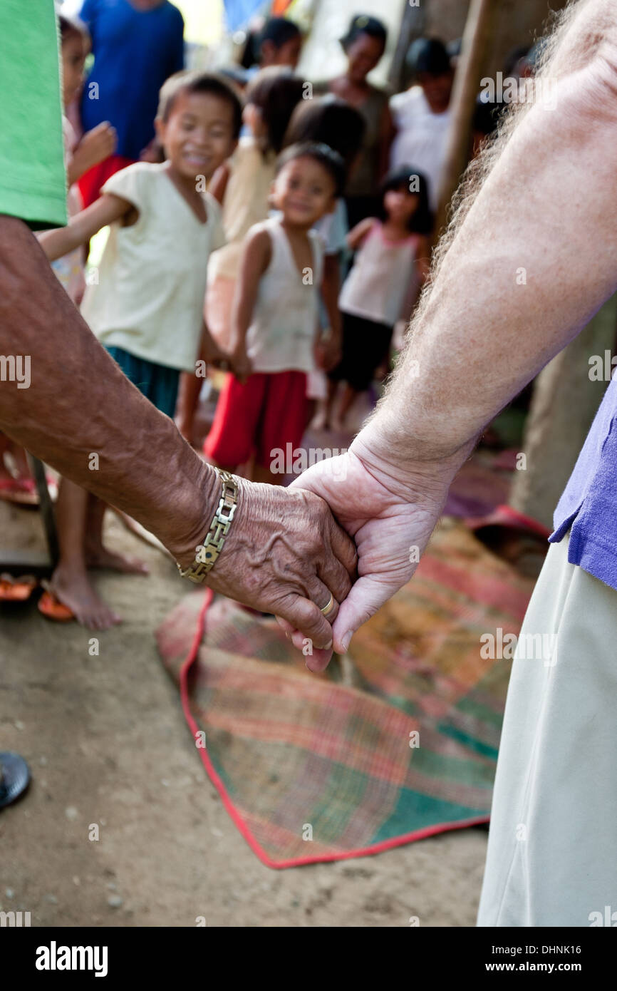 Joining hands in prayer with local believers in a remote island of ...