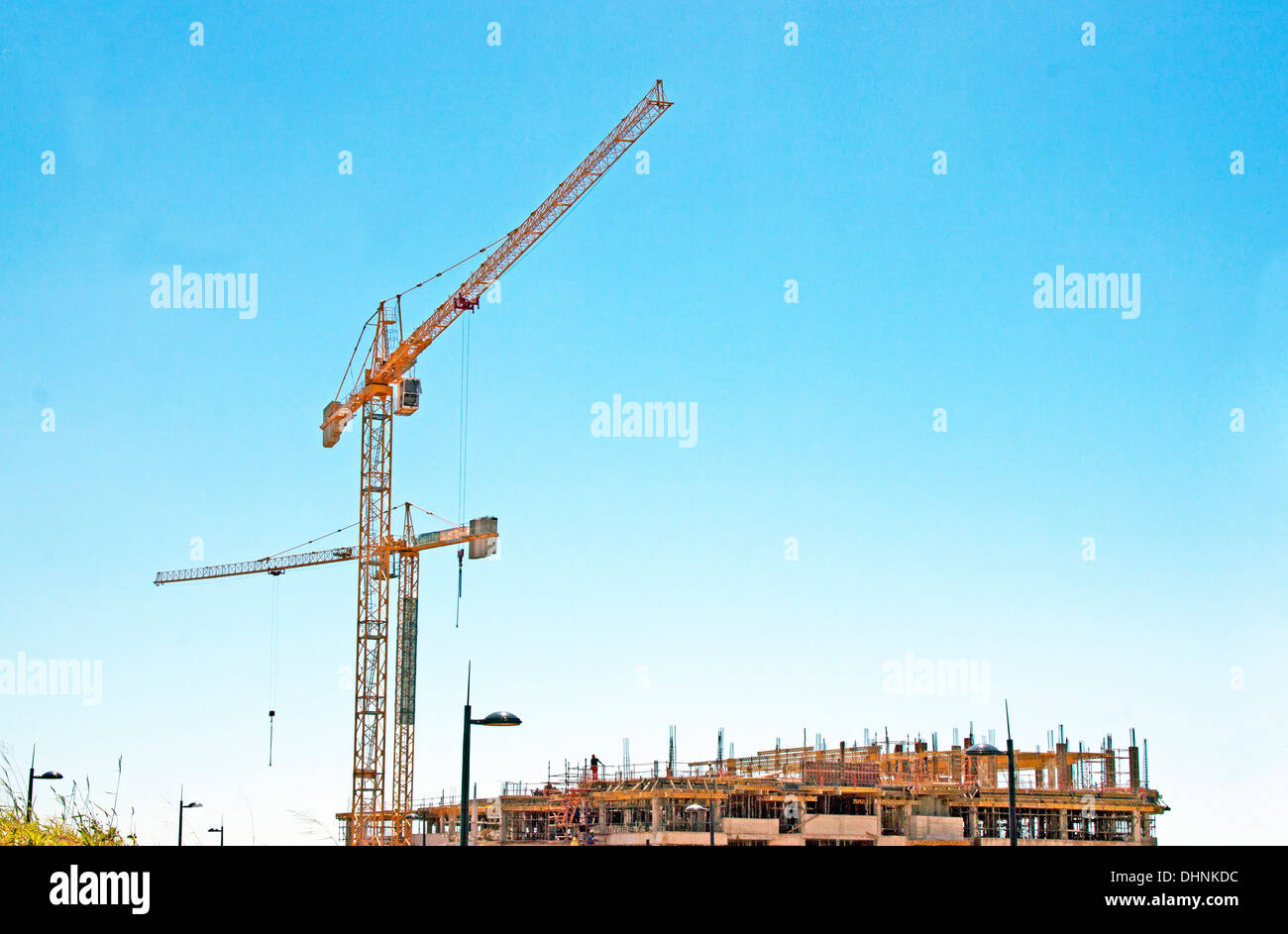 tower cranes working on construction site of hi-rise building Stock ...