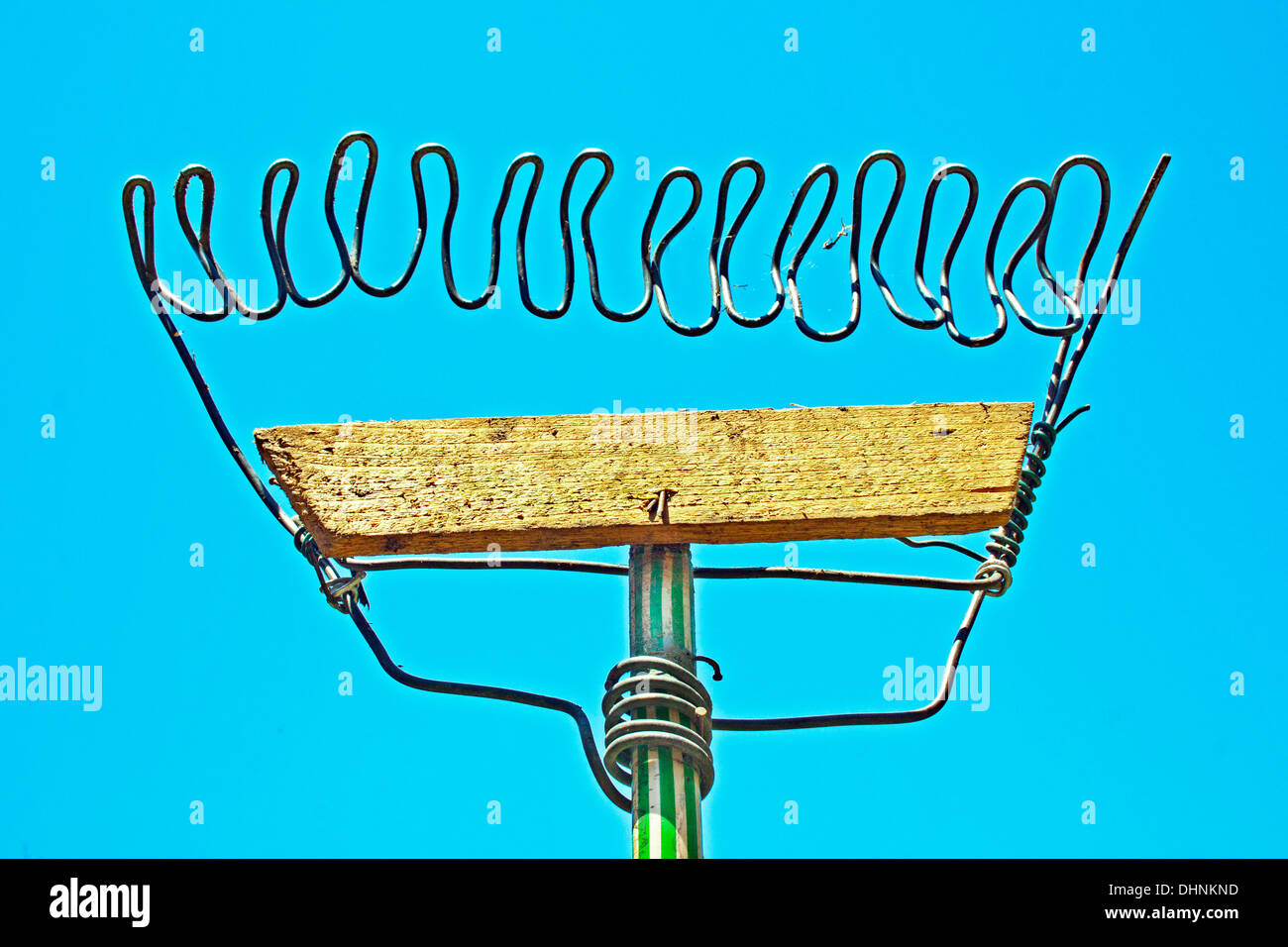 African hand made garden leaf rake against blue sky Stock Photo - Alamy