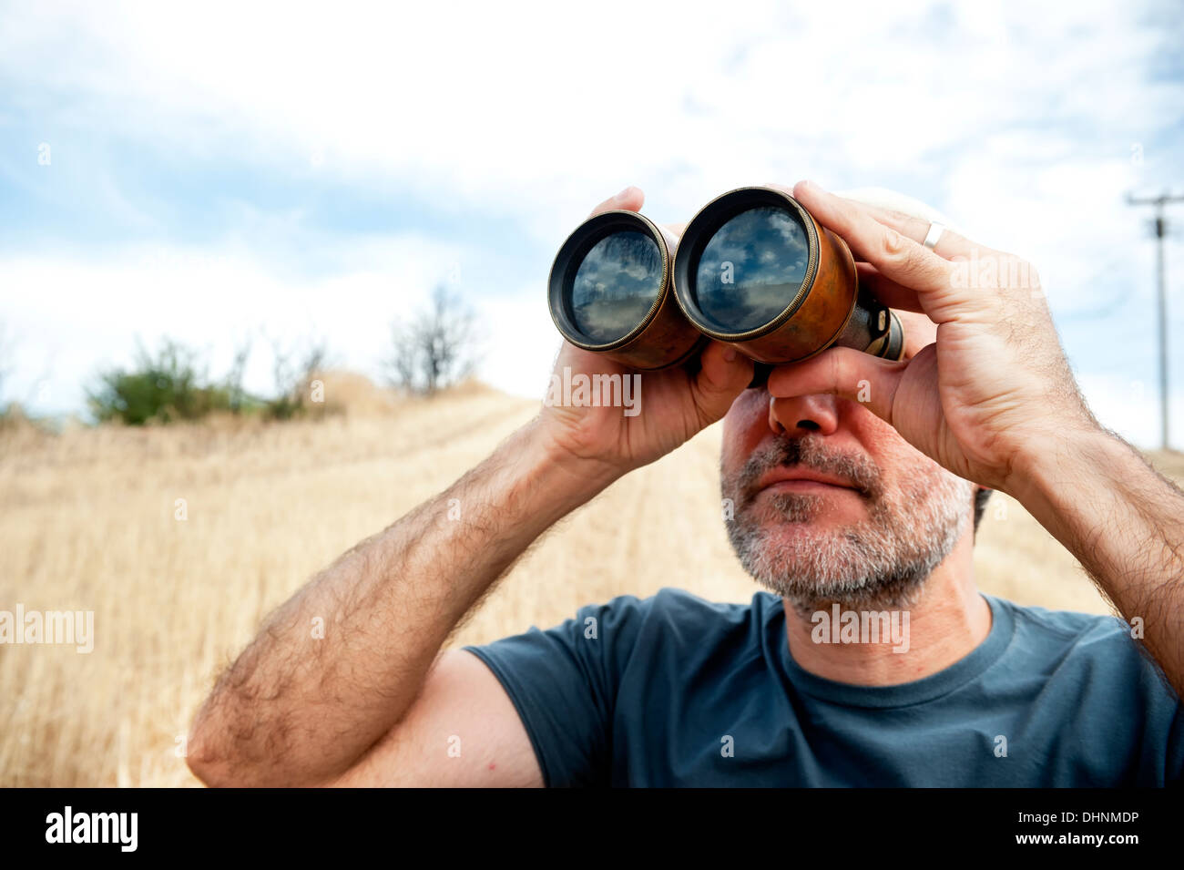 Man in white with binoculars hi-res stock photography and images - Alamy
