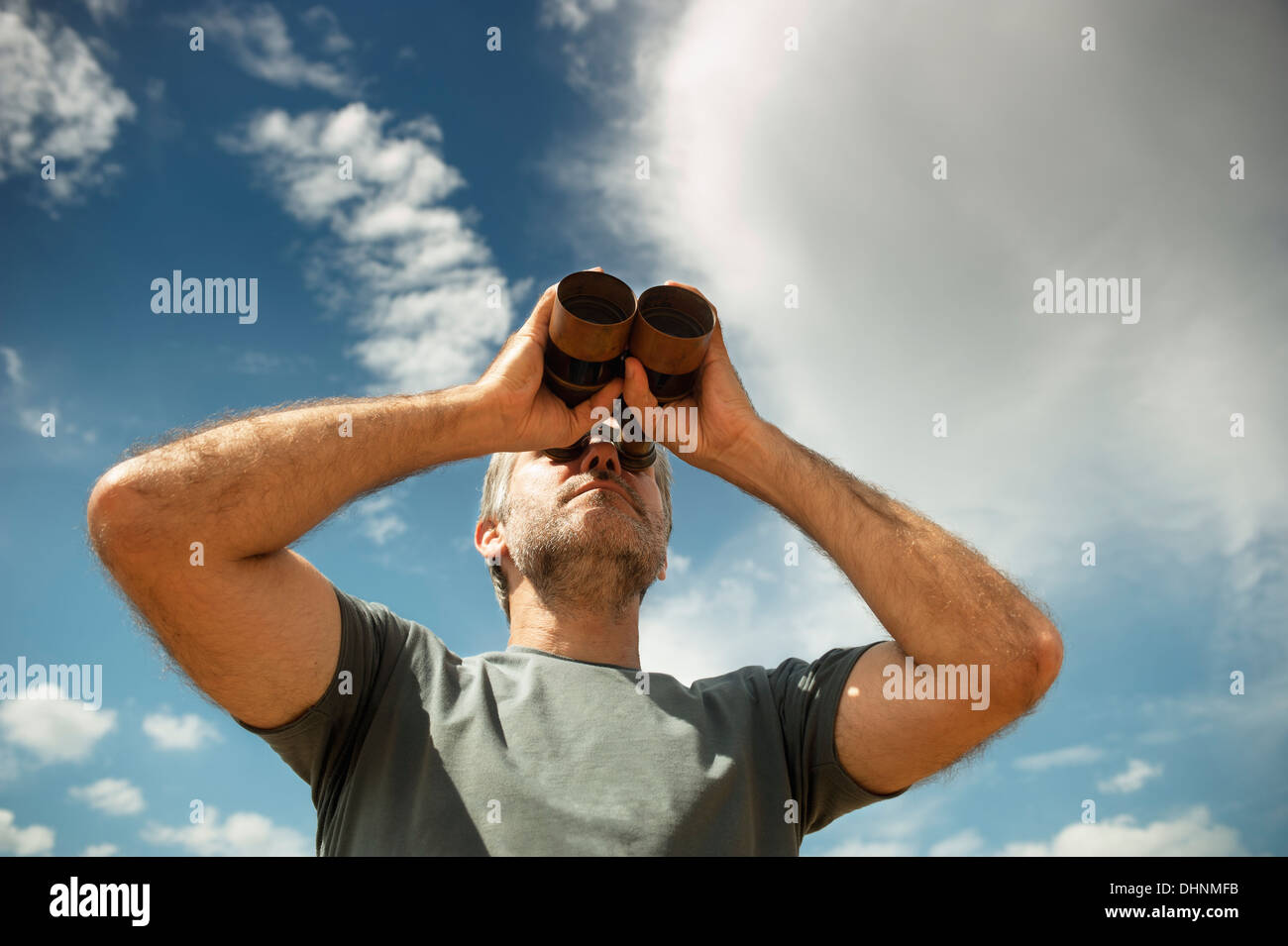 Man in white with binoculars hi-res stock photography and images - Alamy