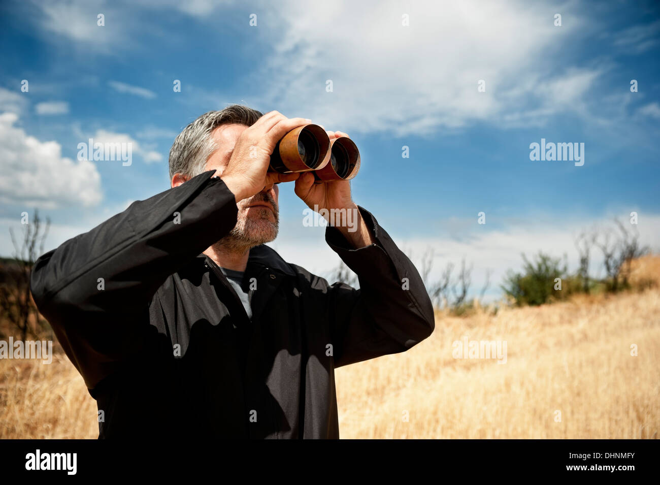 Man in white with binoculars hi-res stock photography and images - Alamy
