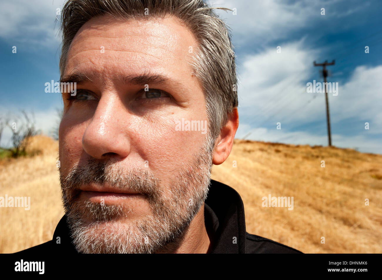 Man alone in field in hi-res stock photography and images - Alamy