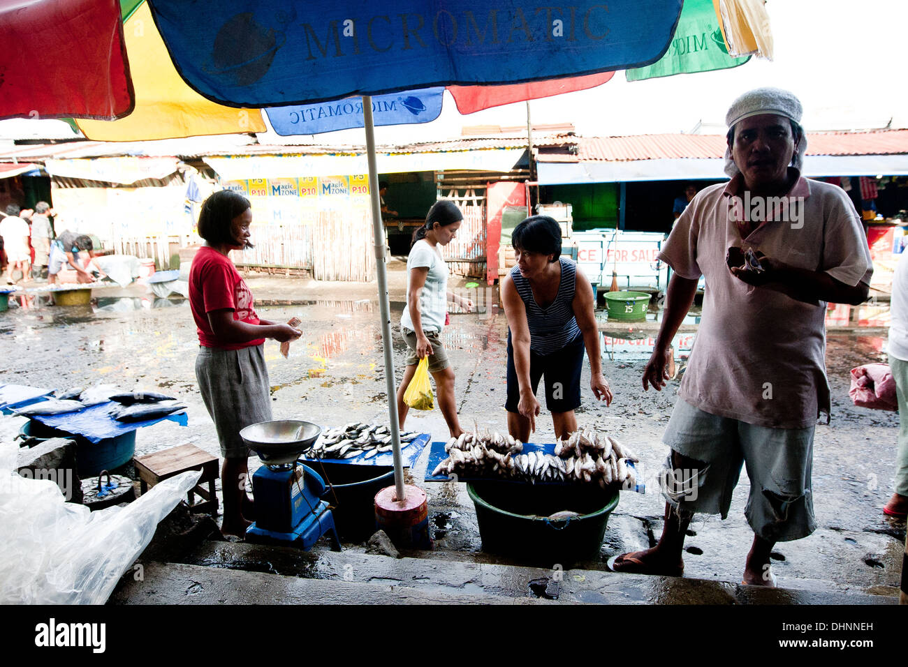 Fishmongers selling fresh produce at the market in Tacloban City Stock ...