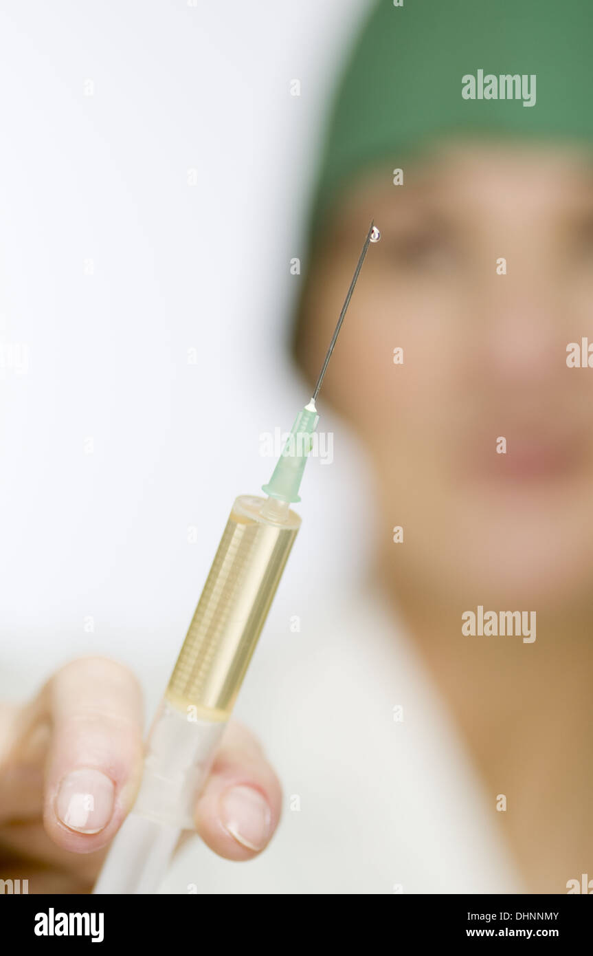 syringe in a hand Stock Photo - Alamy