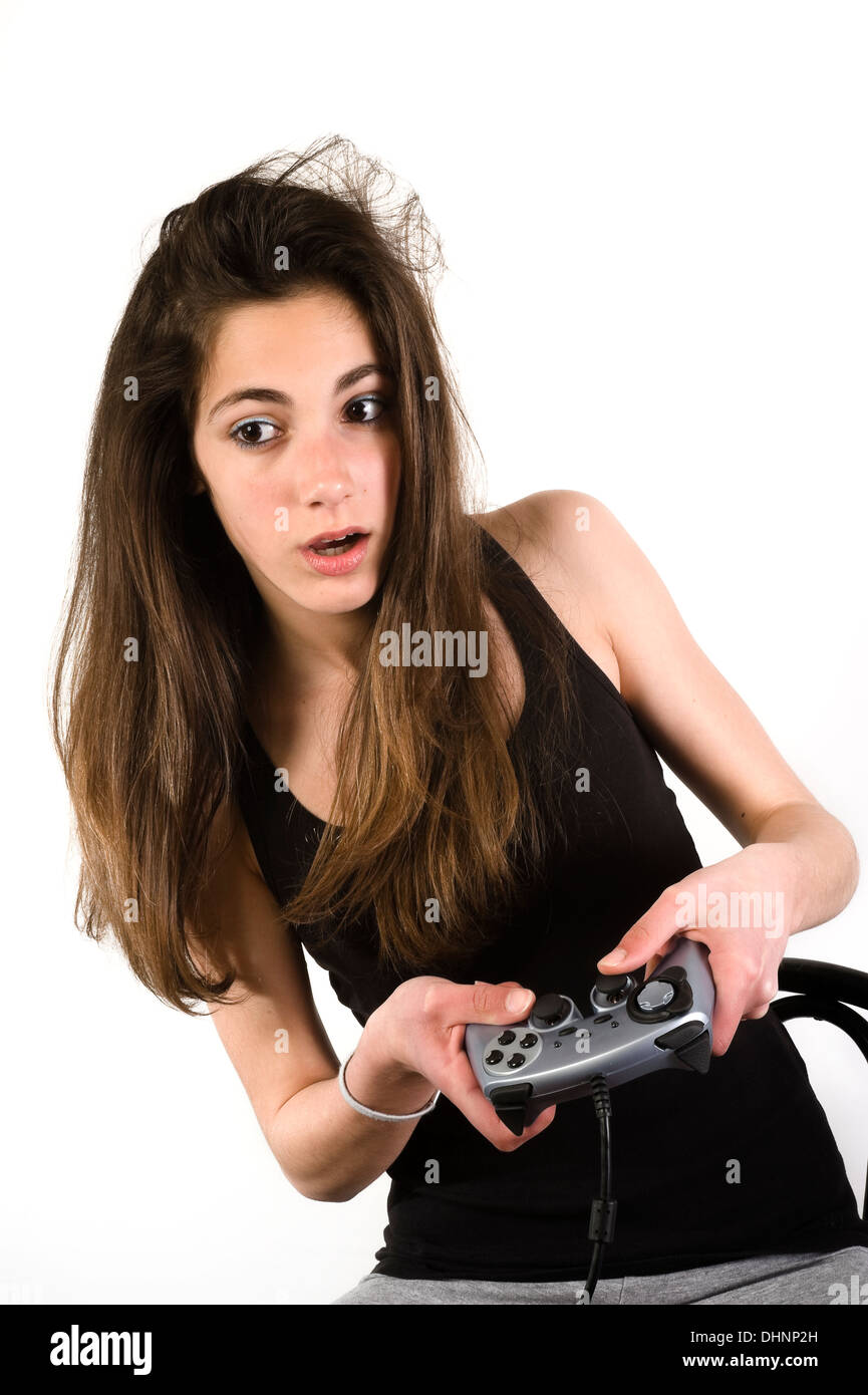 Teenage girl playing video games with a joystick Stock Photo - Alamy