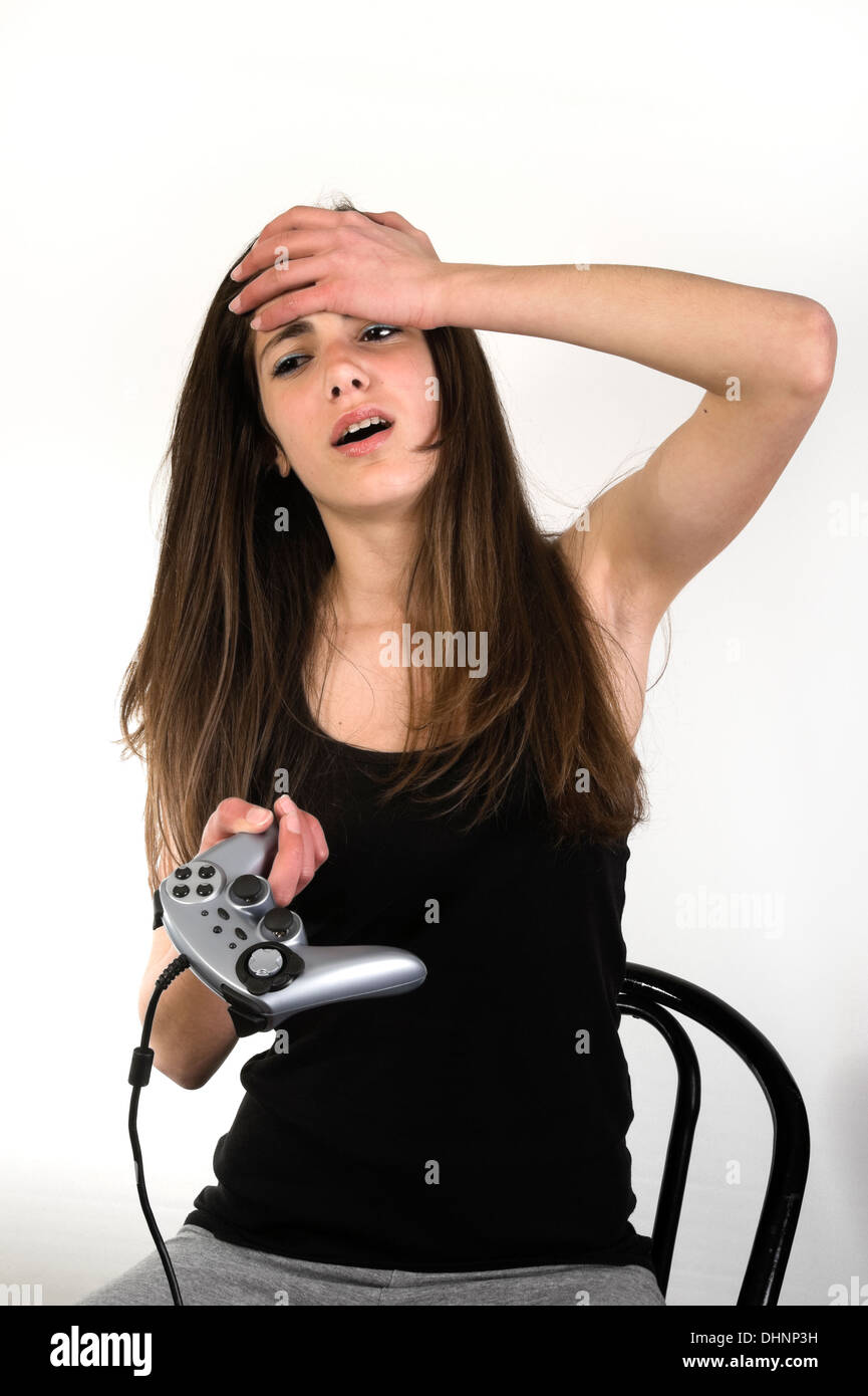 Teenage girl playing video games with a joystick Stock Photo - Alamy