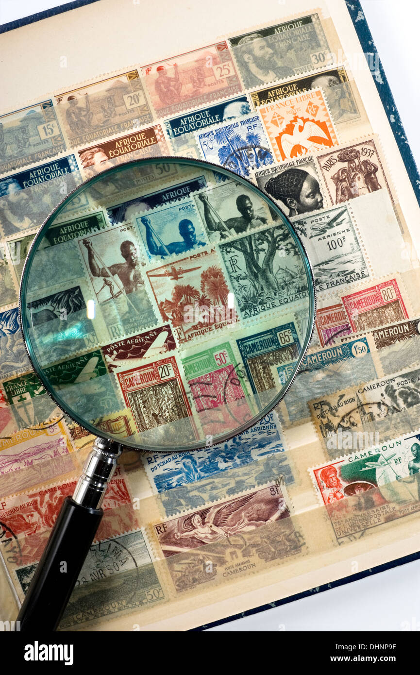 Postage stamp collection album with a magnifying glass on it Stock ...