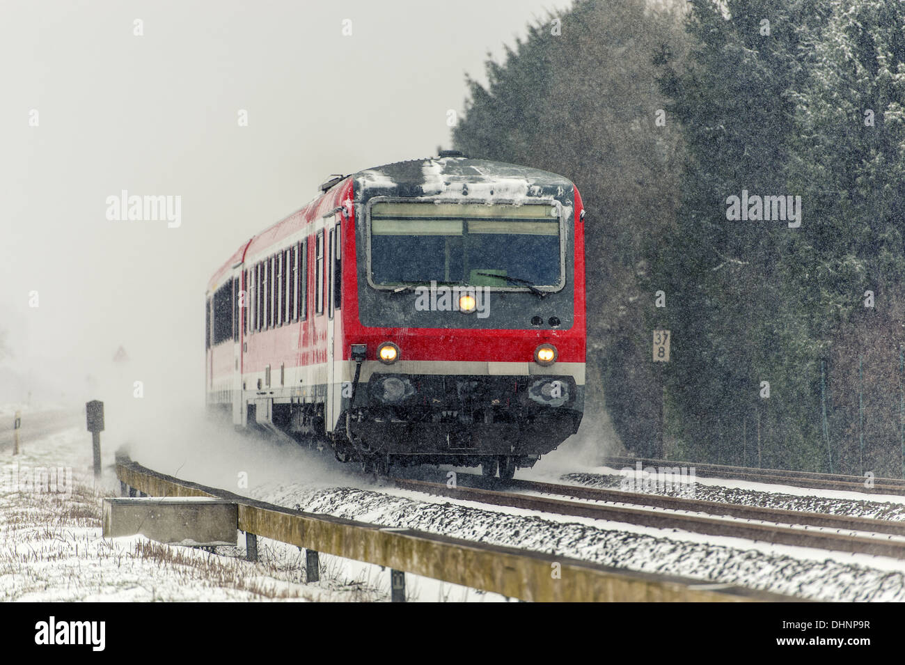 Passenger train in winter with snow Stock Photo - Alamy