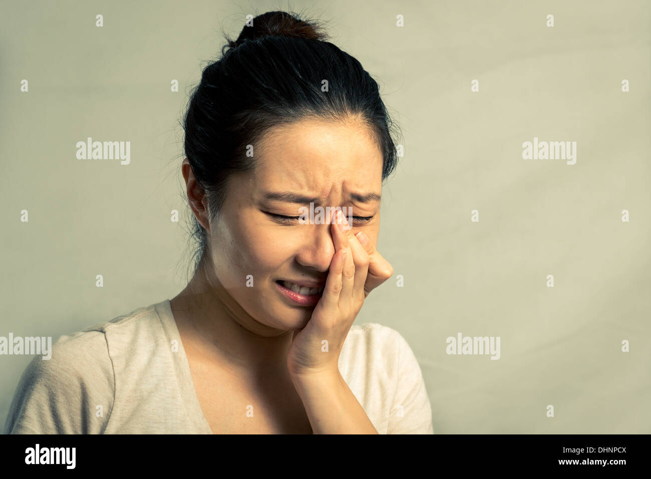 Portrait of young woman crying desperately, with fashion tone and ...