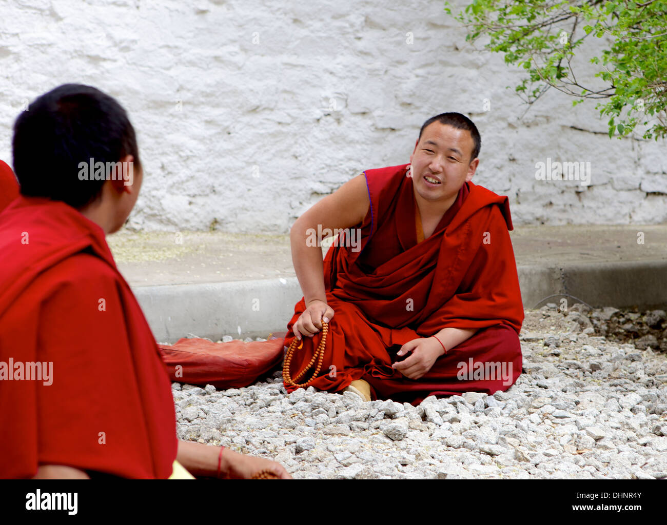 Tibetan Buddhist monks debating in the Debating Courtyard at Sera ...