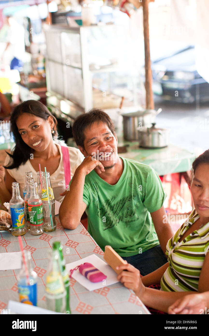 Members of the street community in Davao smile while in a meeting Stock ...