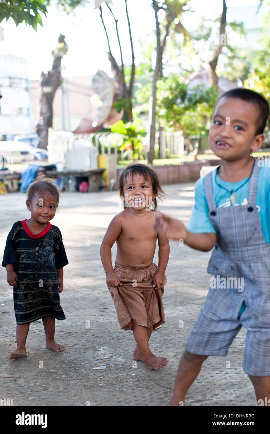 Children laugh and play together on the streets of Davao Stock Photo ...