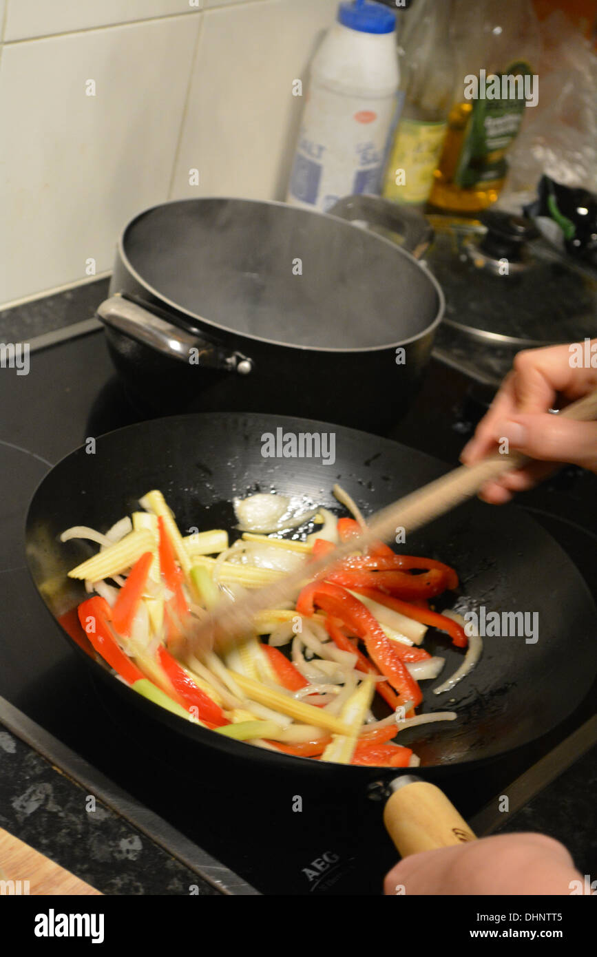 Cooking a mixture of vegetables in a wok Stock Photo - Alamy