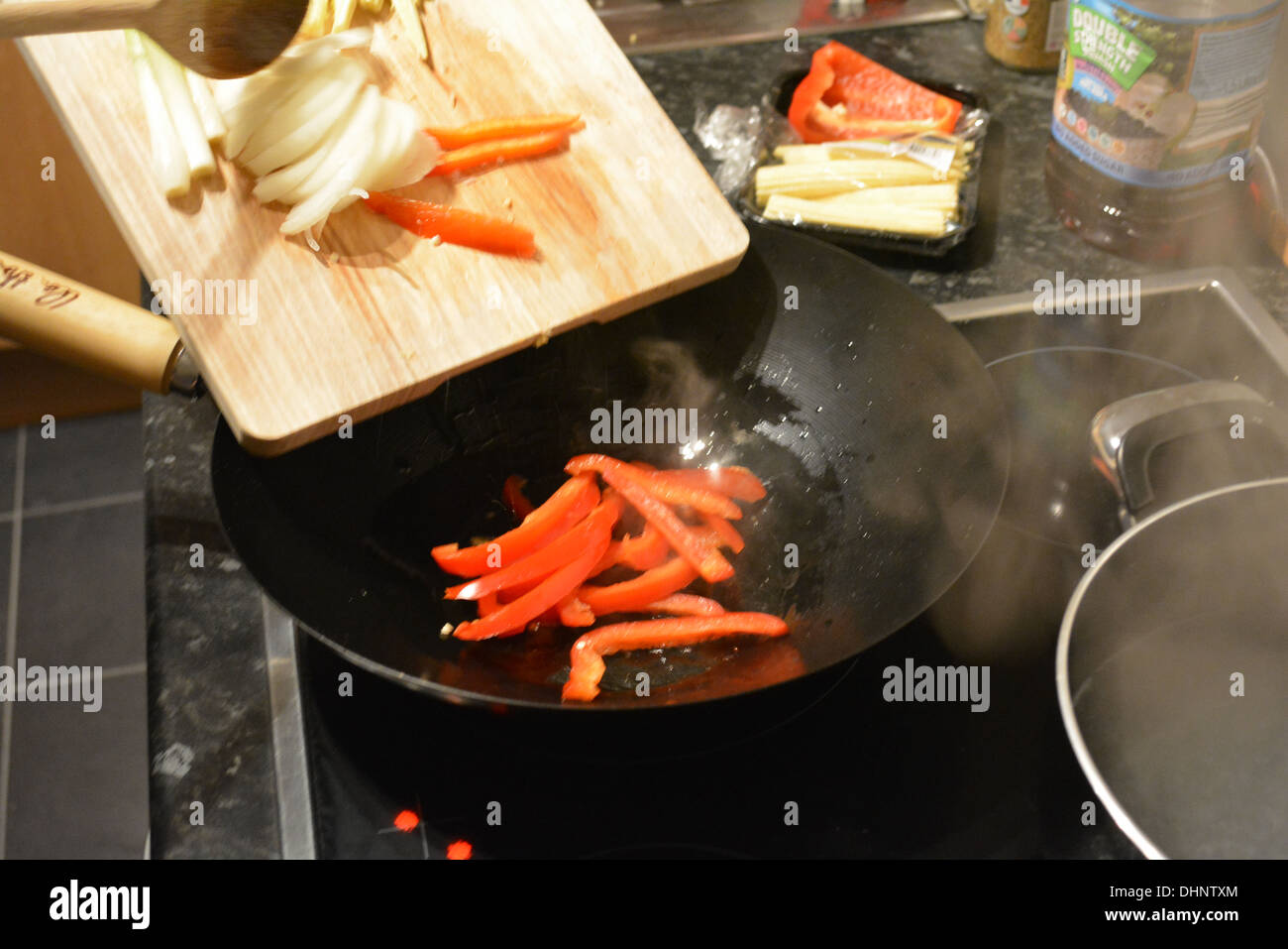 Cooking a mixture of vegetables in a wok Stock Photo - Alamy