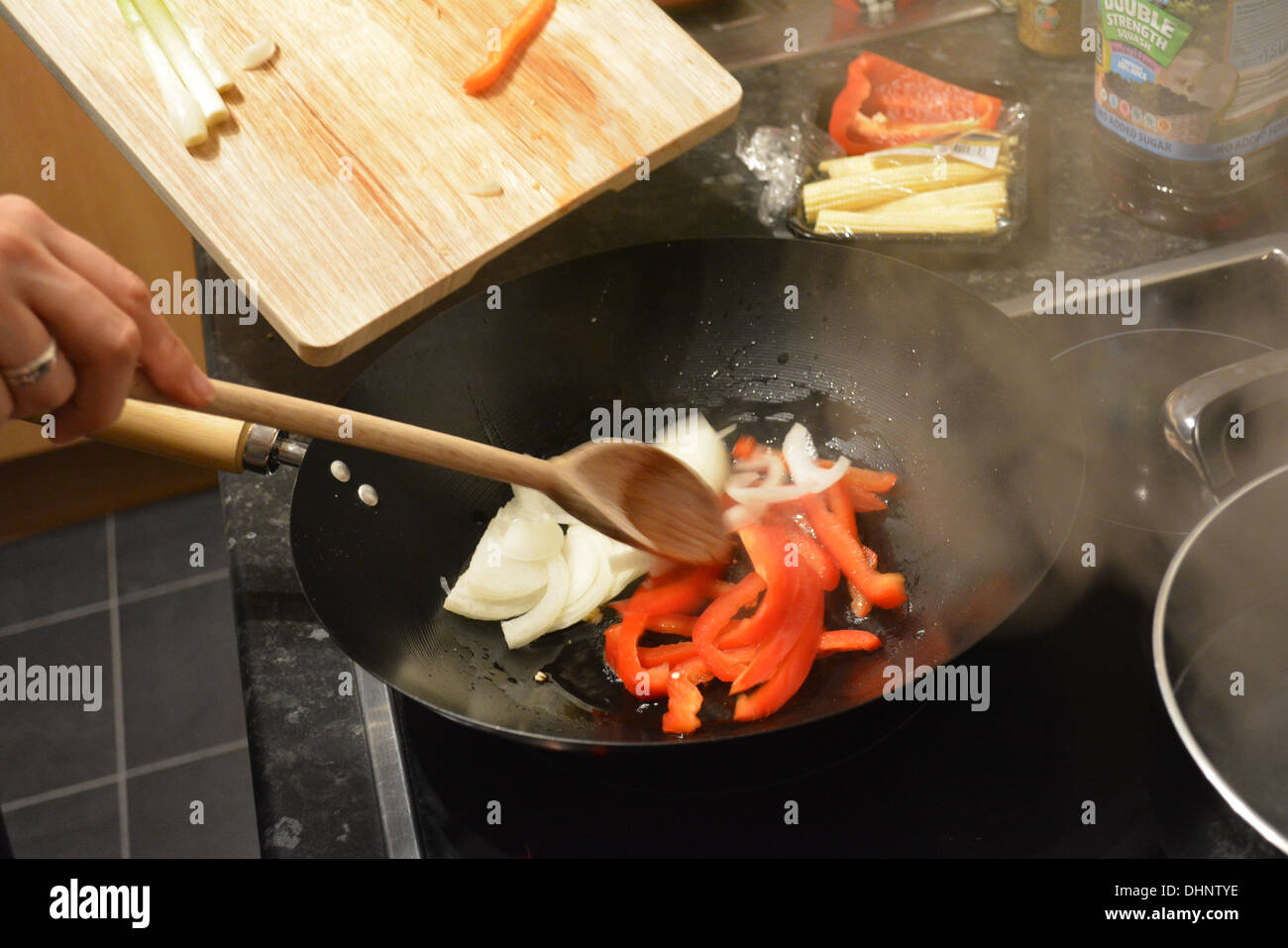 Cooking a mixture of vegetables in a wok Stock Photo - Alamy