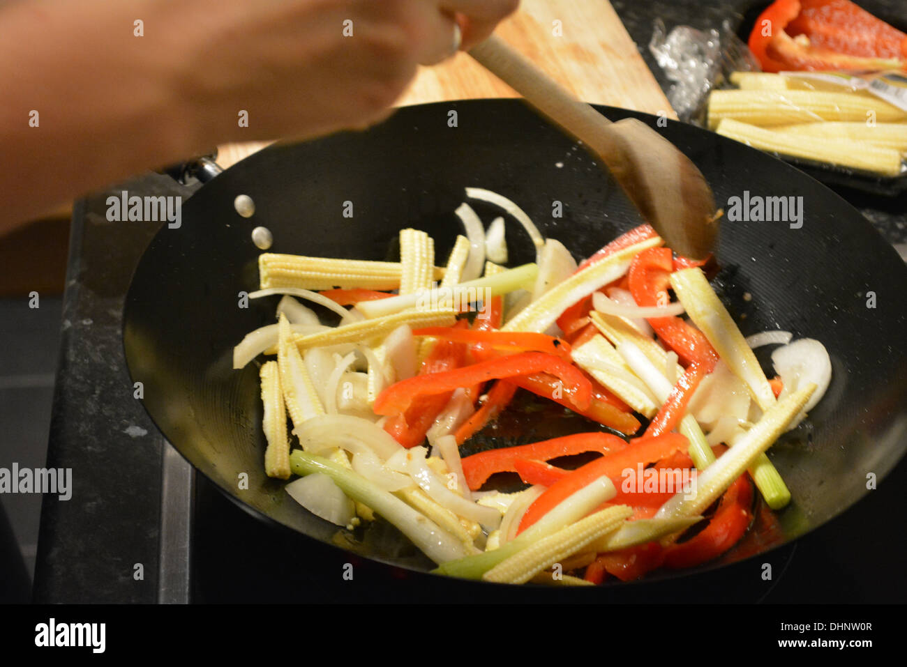 Cooking a mixture of vegetables in a wok Stock Photo - Alamy