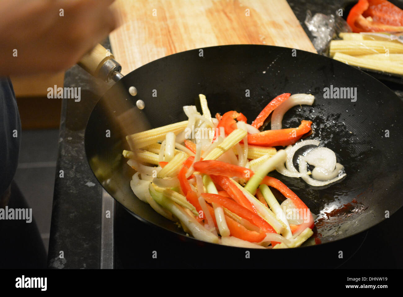 Cooking a mixture of vegetables in a wok Stock Photo - Alamy
