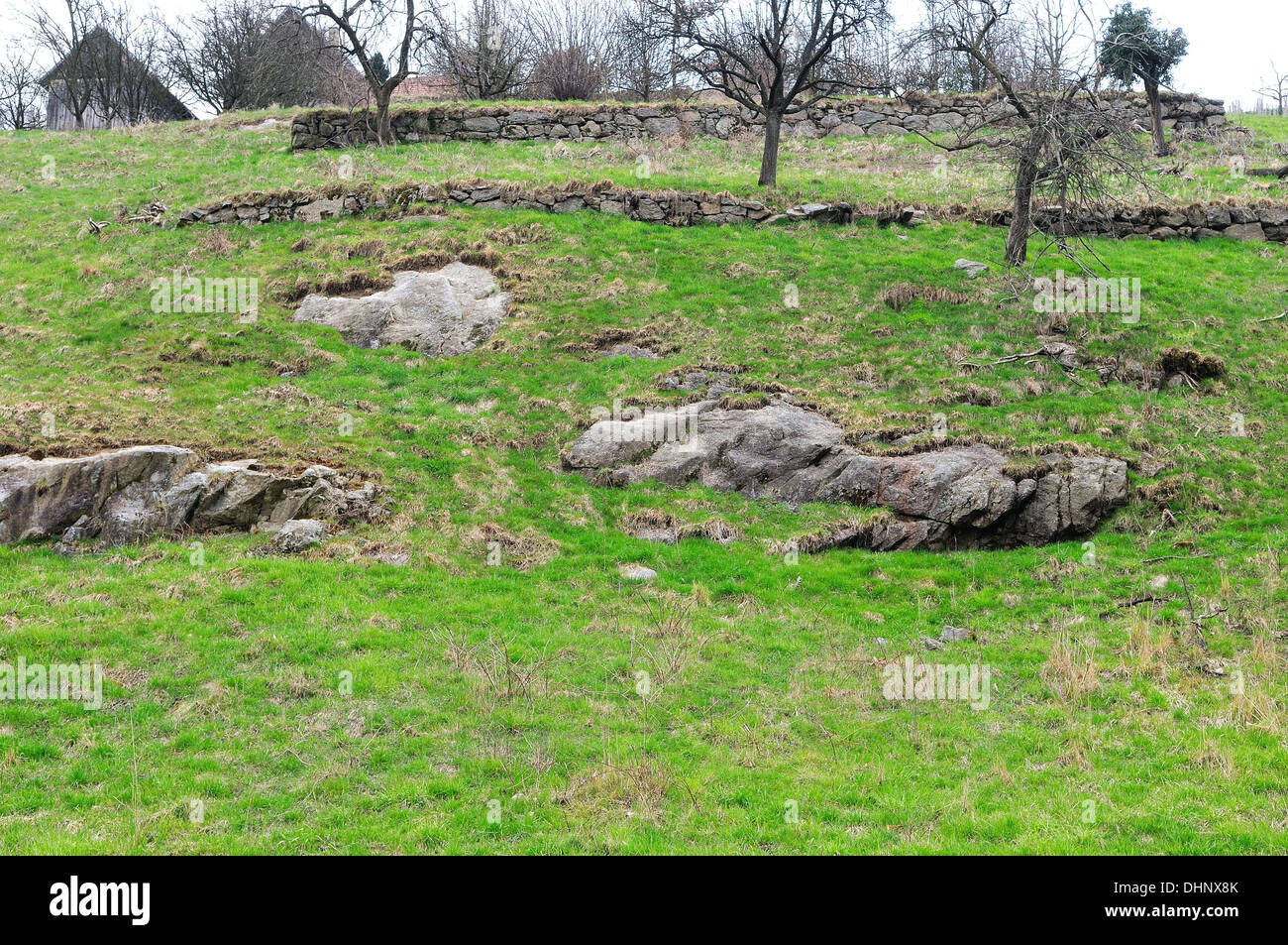 old steep slope management with rocks Stock Photo - Alamy
