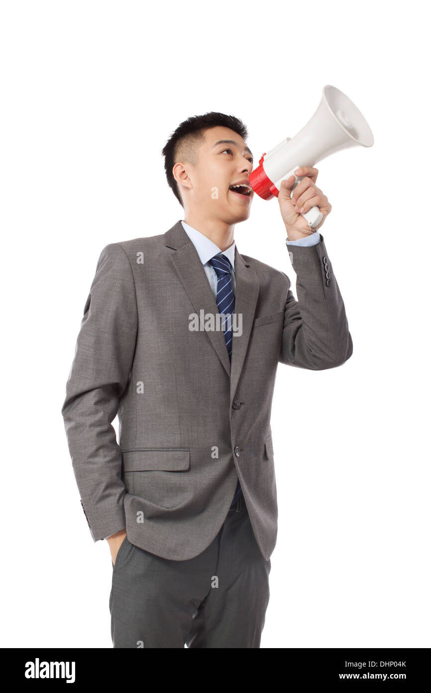 Young businessman shouting into Megaphone Stock Photo - Alamy