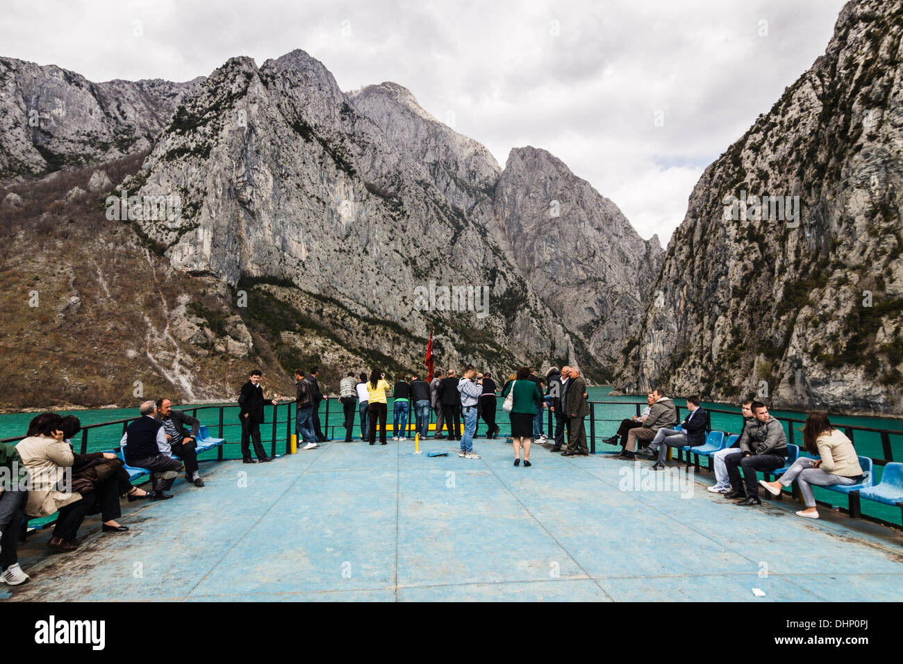 Passengers on the Koman-Fierze ferry through a narrow gorge of the ...