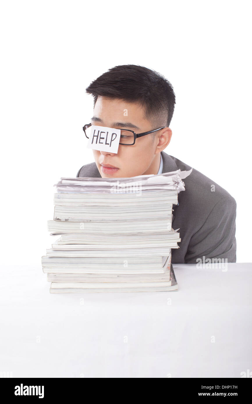 Businessman with large pile of paper work Stock Photo - Alamy