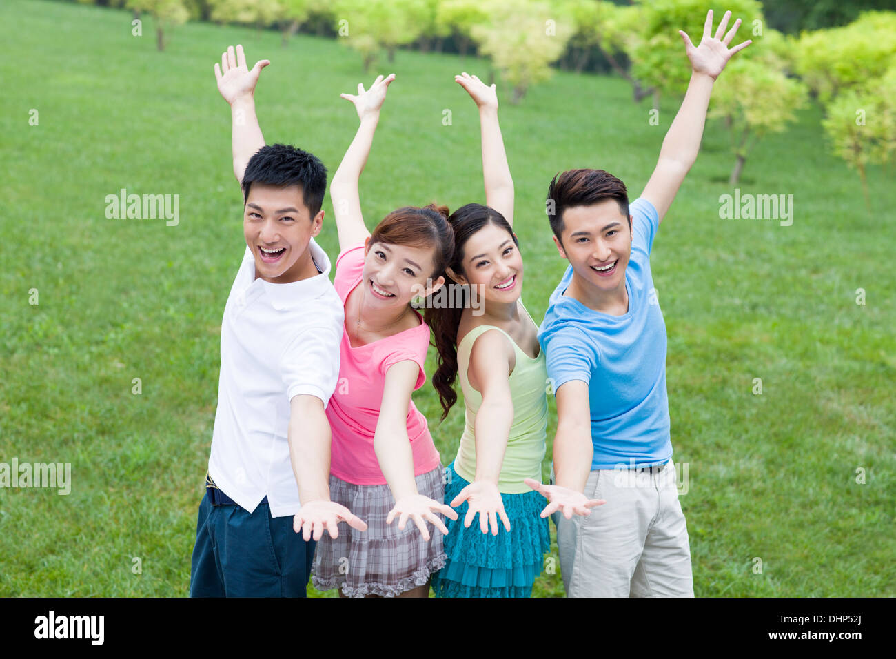 Playful chinese friends enjoying park hi-res stock photography and ...