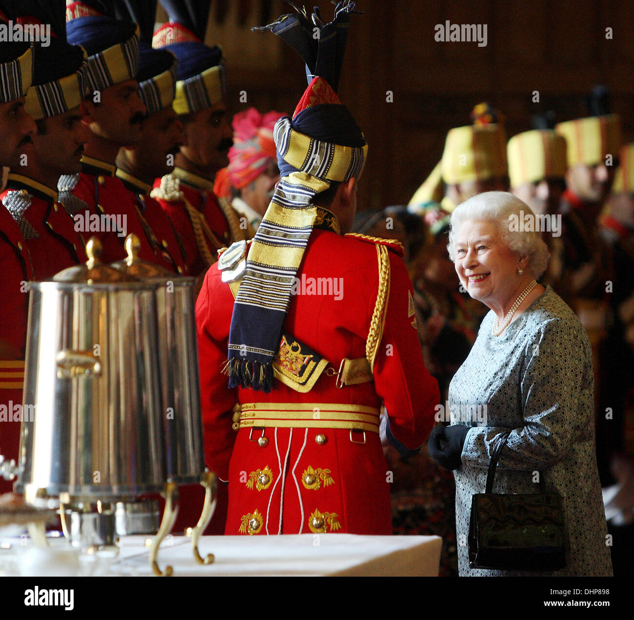 Queen Elizabeth II talks with a member of the Pakistan President's ...