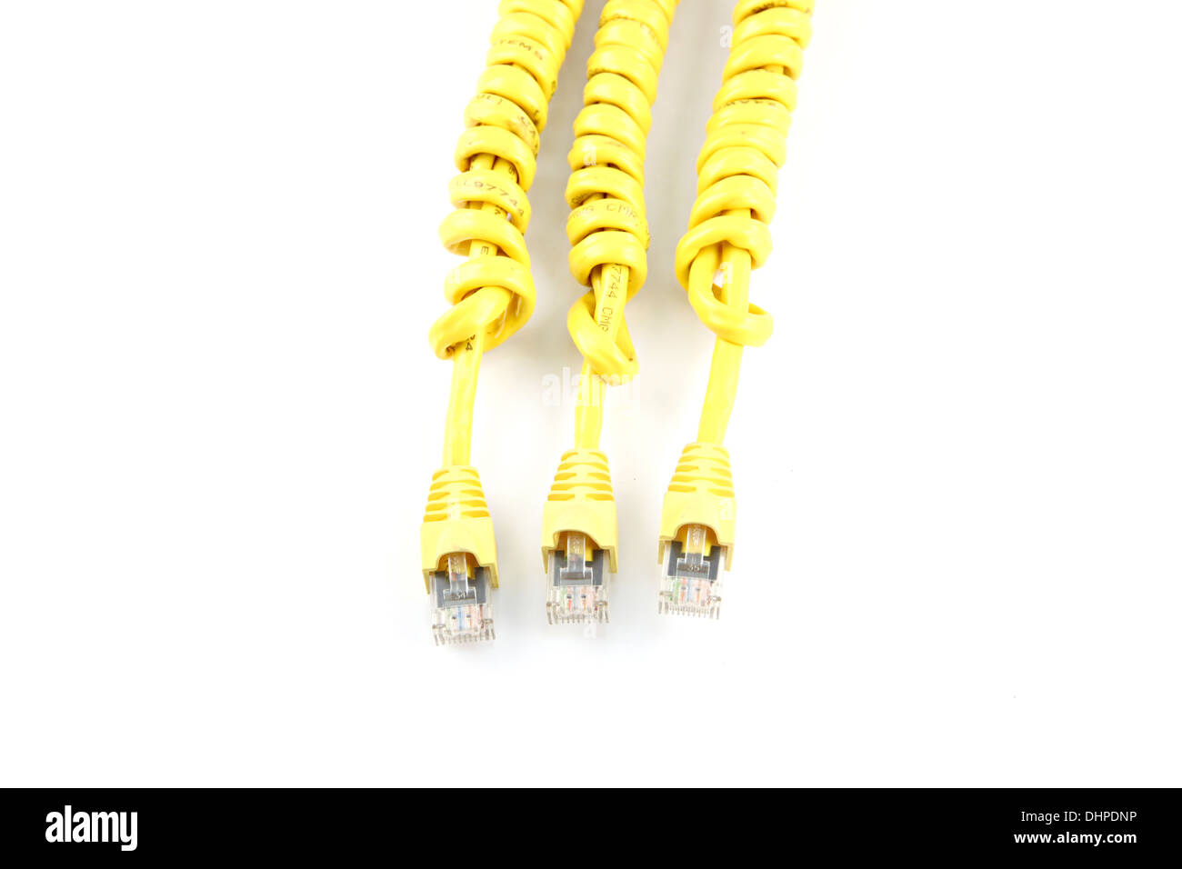 Three Yellow LAN Cables on white background Stock Photo - Alamy