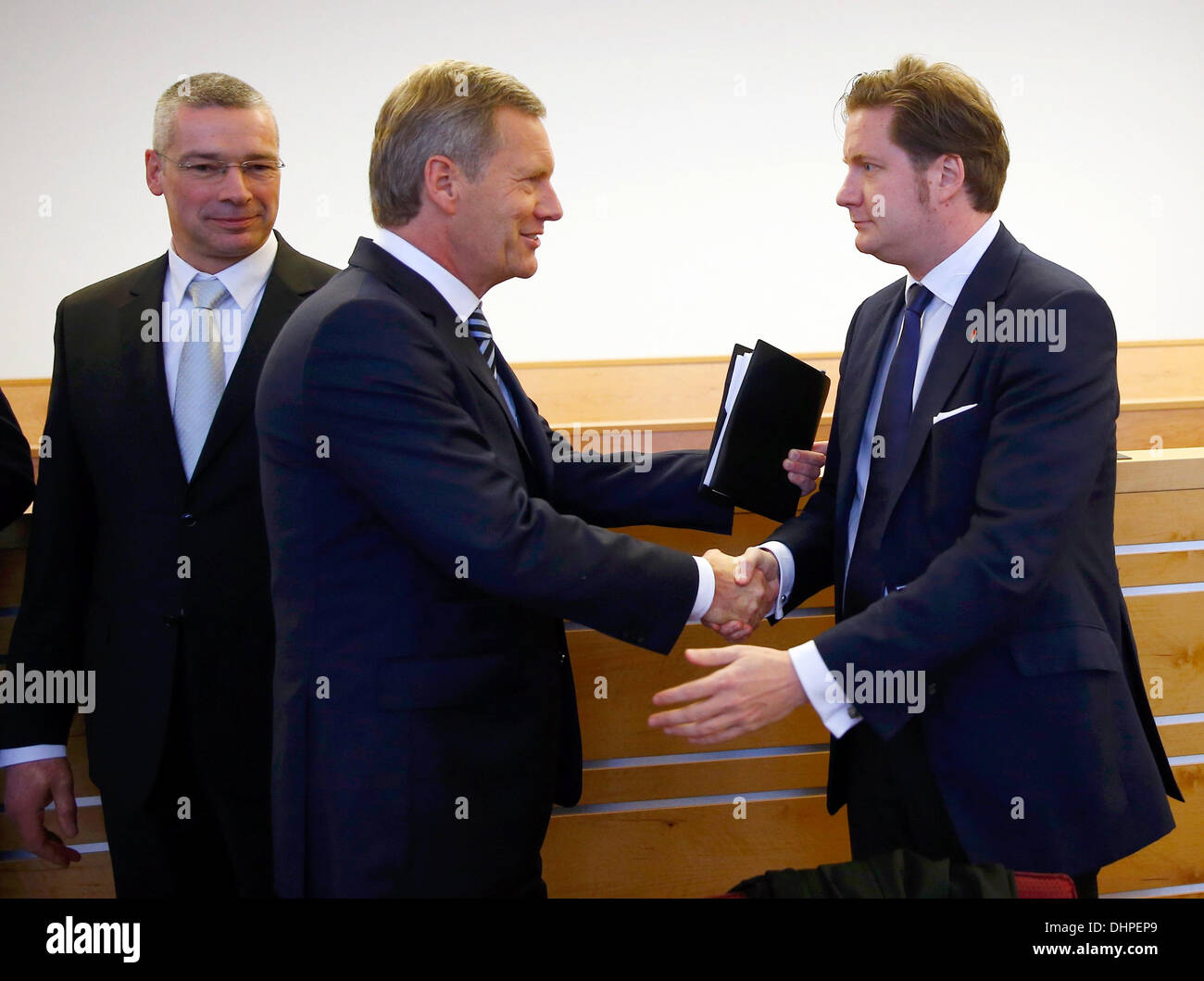 Lawyer Bernd Muessig (L) looks at Former German President Christian ...