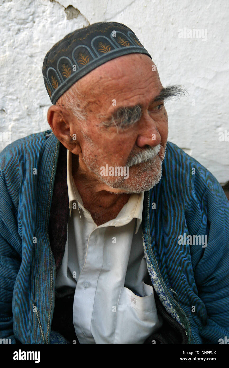 Uzbek Men In Traditional Clothes Chapan High Resolution Stock ...