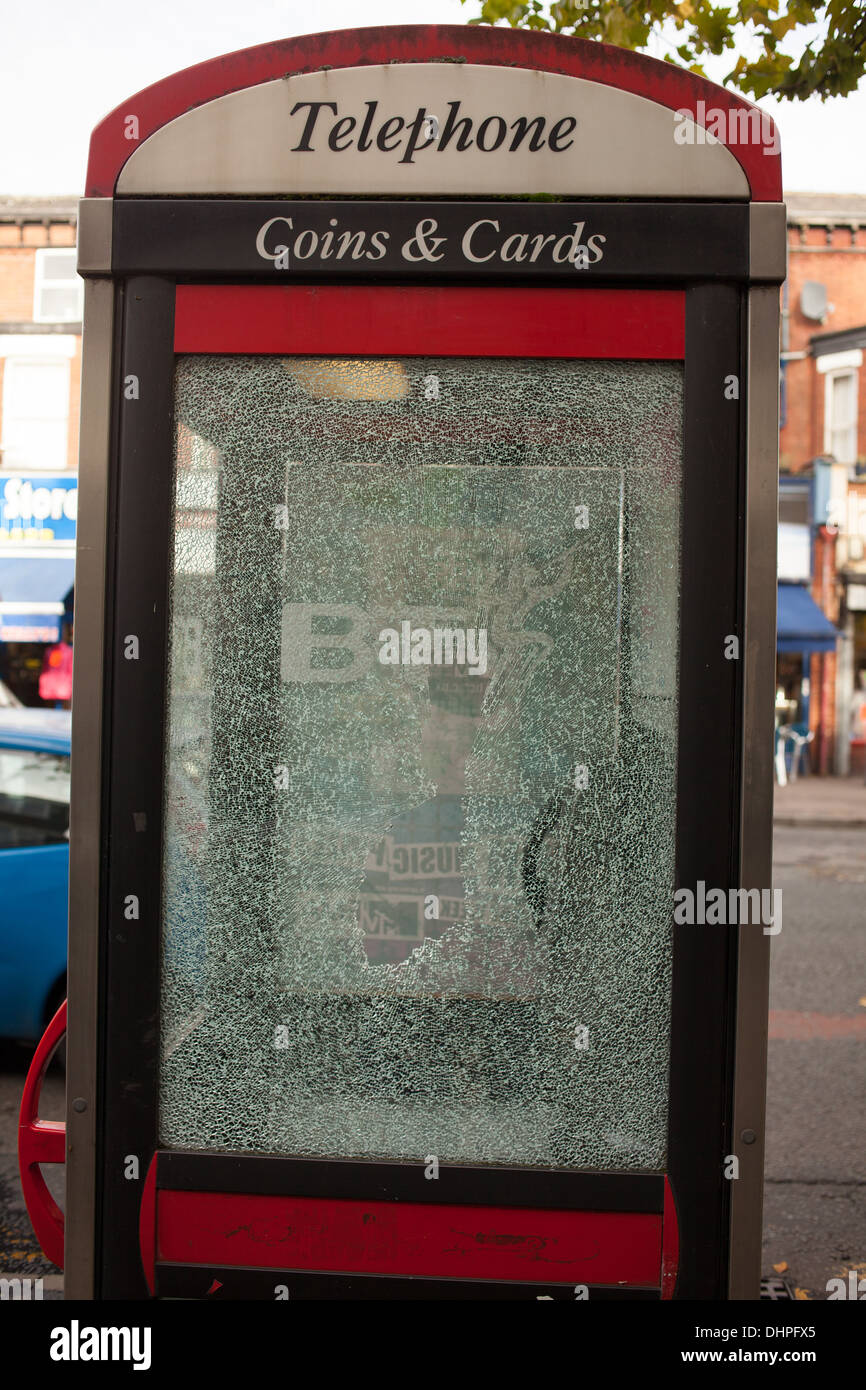 A BT telephone box in Chorlton , Manchester , with a smashed window ...