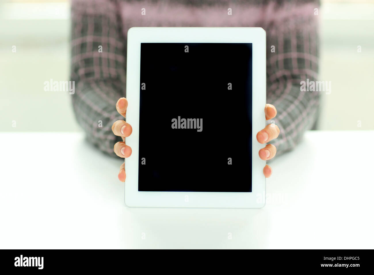 Closeup image of male hands showing display of tablet computer Stock ...