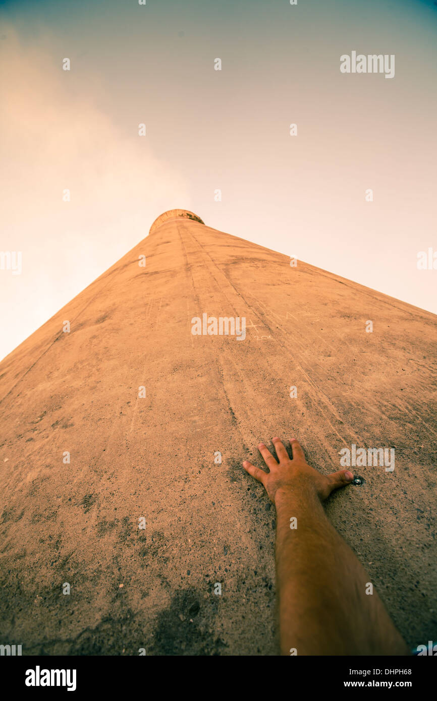 Mans hand on stack of Power Plant Stock Photo - Alamy