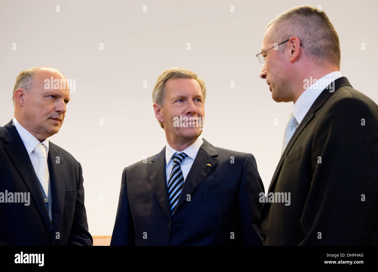 Former German President Christian Wulff (C), and his lawyers Bernd ...