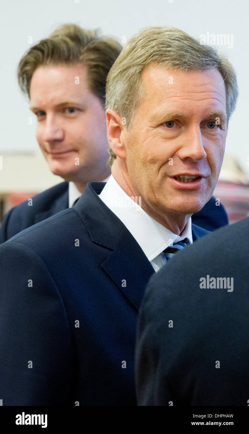Former German President Christian Wulff (front) and co-defendant David ...