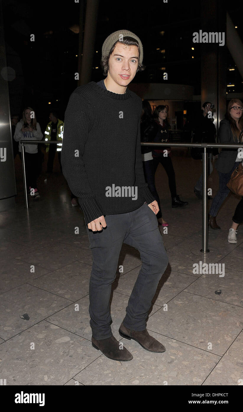 Harry Styles One Direction arrive at Heathrow Airport on alate night ...