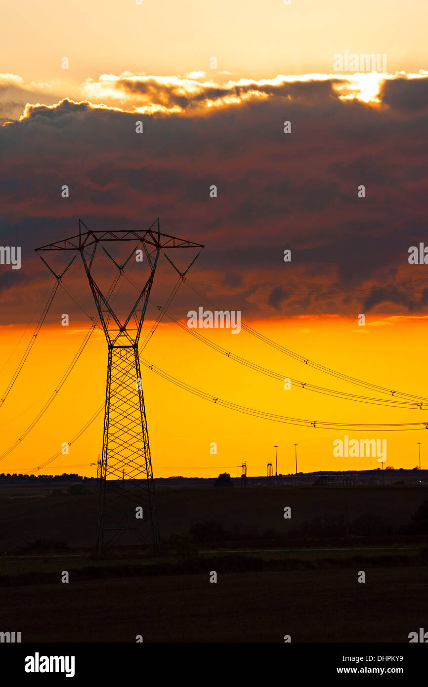 High tension power lines over Tuscanien landscape at sunset, Tuscany ...